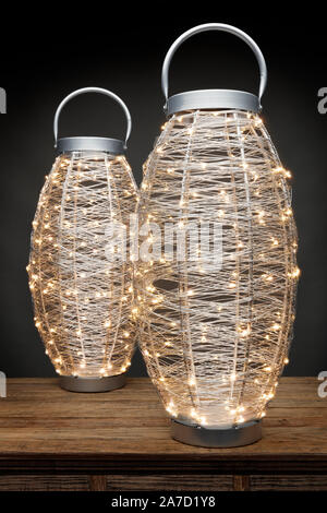 A low-key shot of the Christmas light decorations on a dark sky ...