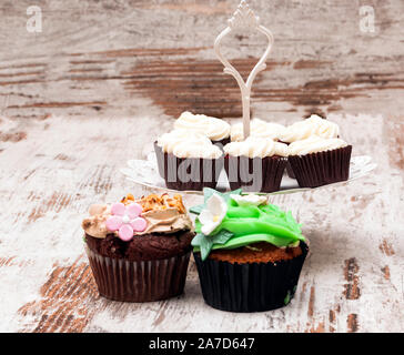 Cupcakes surrounded by rustic background Stock Photo - Alamy
