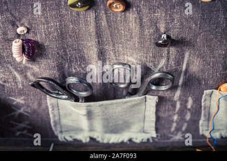 Closeup of sewing mat with scissors in tailor workshop Stock Photo - Alamy