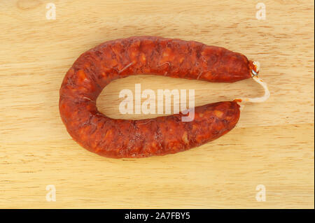 String of Spanish Chorizo sausage on a white plate, Andalucia, Spain ...