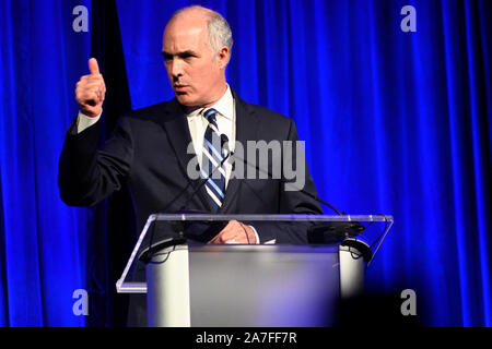 Senator Bob Casey (center) and Pennsylvania Governor Tom Wolf listen as ...