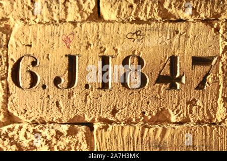 Quarry inspector inscription on bricks inside the Paris Catacombs Stock ...