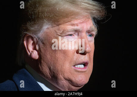 President Donald Trump speaks with reporters alongside Nassau County ...