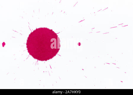 Red ink dot splashed on white paper background Stock Photo - Alamy
