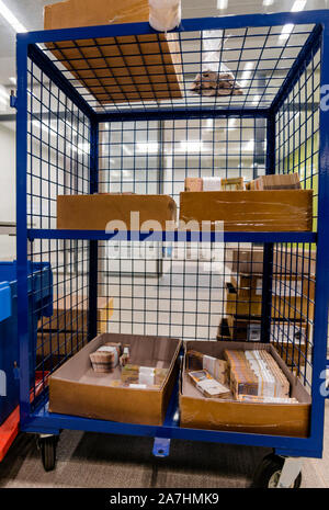 Carton boxes filled with sorted money and stored in a cage in the ...