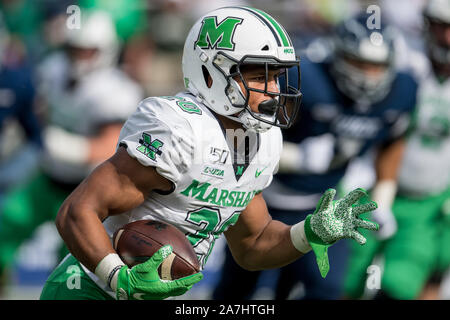 Marshall running back Brenden Knox, right, attempts to juke past ...