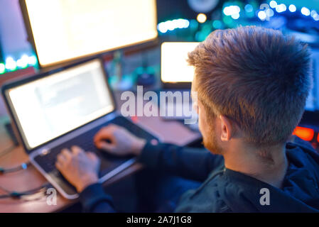 Programmer Or Coder At Office Desk Using Laptop Stock Photo - Alamy