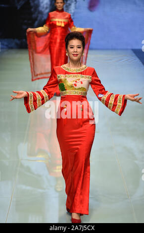 Elder models wearing traditional Chinese outfit designed by Chen Fumei ...