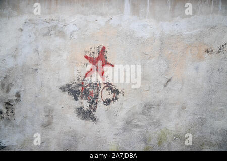 Old grungy communism symbol graffiti on a wall, red color Stock Photo ...