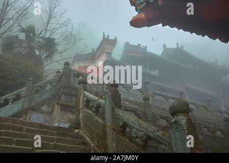 The steps of stair in ancient taoist martial arts wushu temple on foggy ...