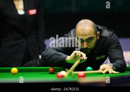 Hossein Vafaei of Iran plays a shot to Mark Williams of Wales at the ...