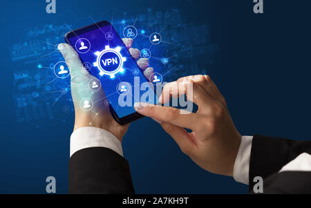 Female hand holding smartphone with VPN abbreviation, modern technology ...