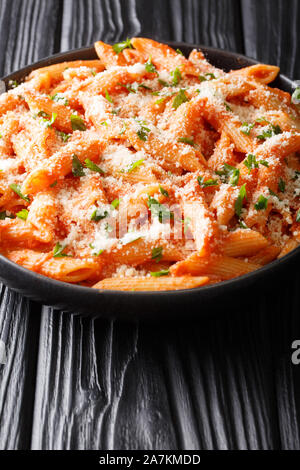 hot cooked penne on black plate on kitchen countertop, wide photo Stock ...