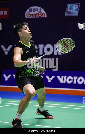Hong Kong professional badminton player Wong Wing Ki competes against ...