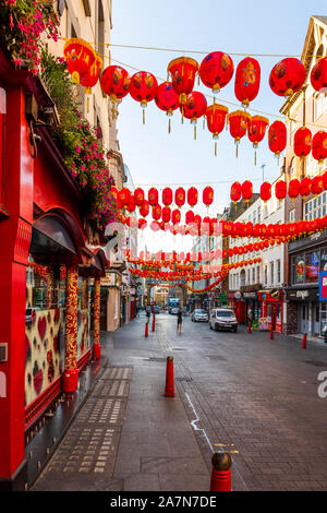 Wardour Street in Chinatown, London, bustling with crowds of shoppers and tourists. People ...