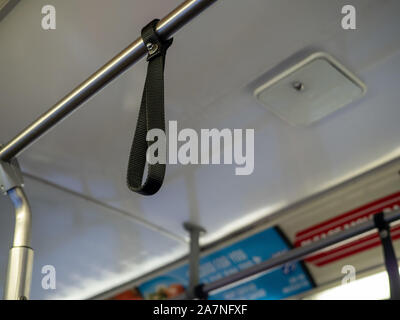Interior of bus. Yellow handrail in transport. Public transport inside ...