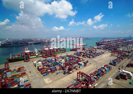 A cargo ship loaded with foreign trade containers departs from berth at ...