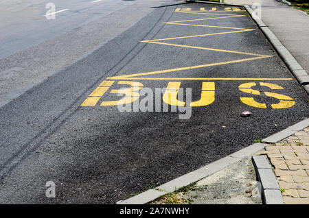 Yellow bus stop road marking symbolizing transport, mobility, travel ...
