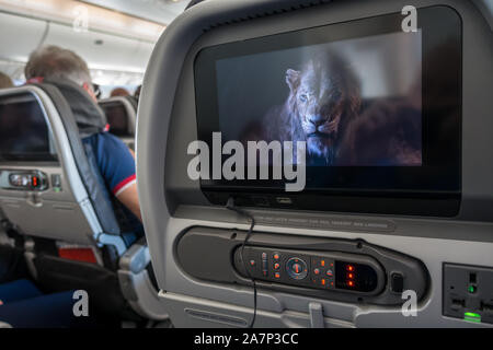 In-flight entertainment system screen inside the cabin of a Emirates ...