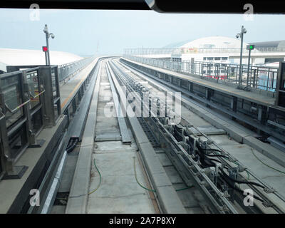 Chinese workers introduce the Light Rail Transit (LRT) system at the ...
