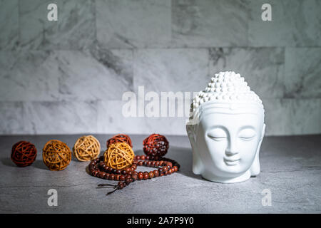 Home decoration ornament. White buddha head face, rattan cane balls ...