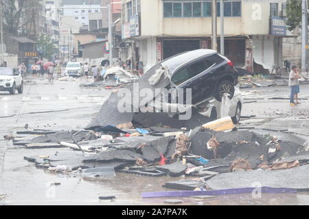 A car is devastated by strong wind and heavy rainstorm caused by ...
