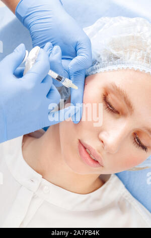 The doctor doing medical injection in hospital room Stock Photo - Alamy