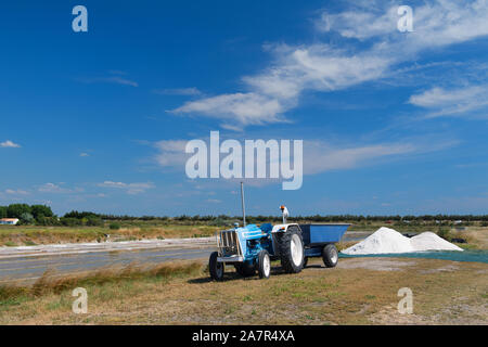 Ile de Re salt lakes and tractor Stock Photo - Alamy