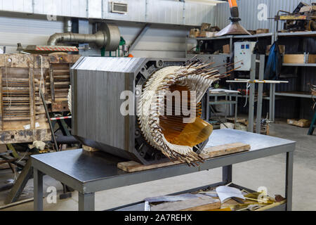 The stator of an industrial electric motor at the assembly stage. Thick ...