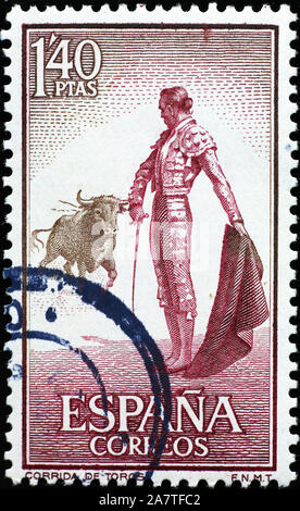 Bullfighter and bull on vintage spanish stamp Stock Photo - Alamy
