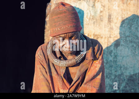 A chief of an indigenous Himba people tribe and his wife are posing in ...