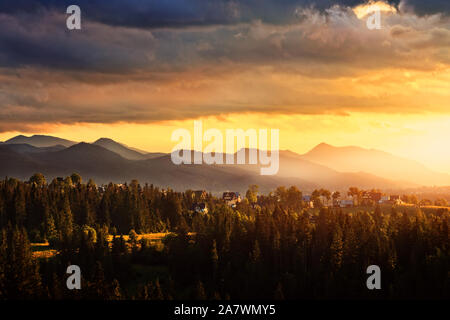 Misty sunset on polish mountains Stock Photo - Alamy