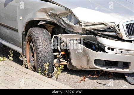 Road accident. Car with the front bumper ripped off following a ...