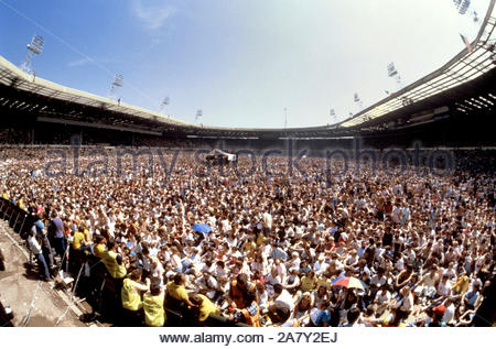 LIVE AID Wembley Stadium 13 July 1985. Clearing up.Photo Hanne Jordan ...