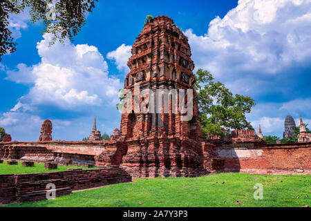 Crumbling temple structures in mid day with blue skies around the ...