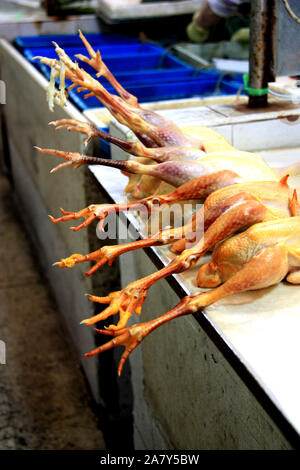 raw chickens legs on market Stock Photo - Alamy