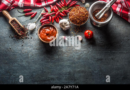 Top view of chili pepper, garlic and herbs on dark wooden surface Stock ...