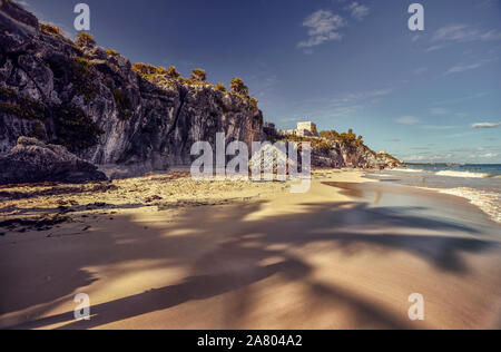 Sunset view at Mayan ruins of Tulum at tropical coast. El Castillo ...