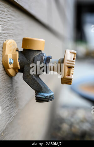 Handle-Operated Freezeless Residential Wall Hydrant mounted on exterior ...