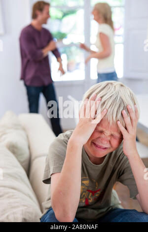 Parents arguing with son Stock Photo - Alamy