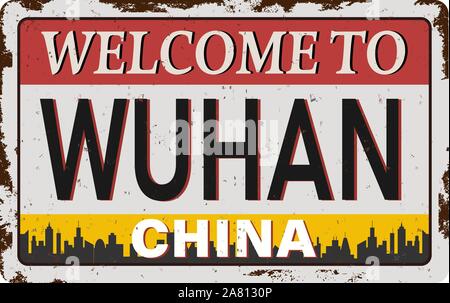 Vintage grunge Welcome to Wuhan China rusted plate on white background ...
