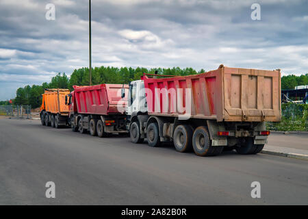 Construction site. Trucks waiting for the earth to be loaded by the ...