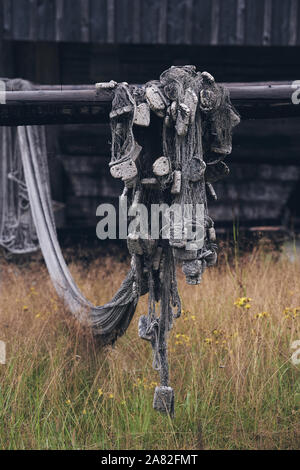 Old style fishing net hanging to dry closeup Stock Photo - Alamy