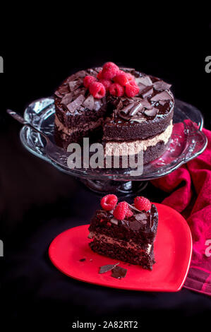 Delicious fruit cake with raspberries and candle in form of number two ...