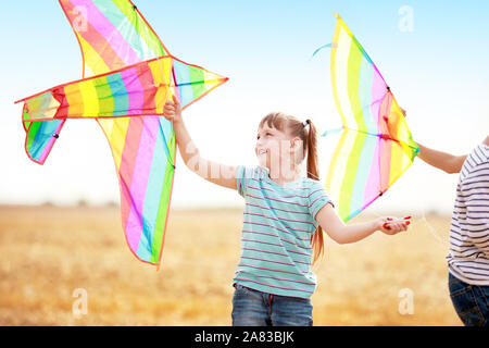 Little children flying kites outdoors Stock Photo - Alamy