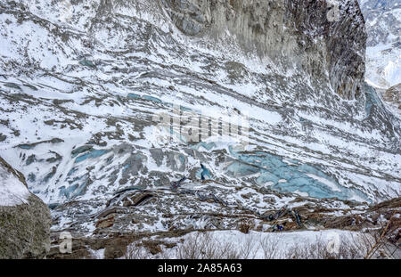 Visiters enterning ice cave under massive glacier near Chamonix in ...