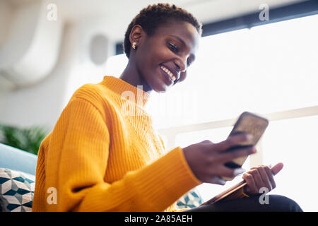 Smiling businesswoman using smart phone in car Stock Photo - Alamy