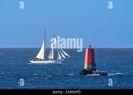 Sailing ship passing red sea mark / seamark / navigation mark on the ...