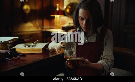 London.UK. Dafne Keen and shape shifting daemon Pantalaimon (voiced by ...