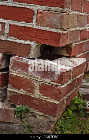Collapsing brick foundation of a building Stock Photo - Alamy